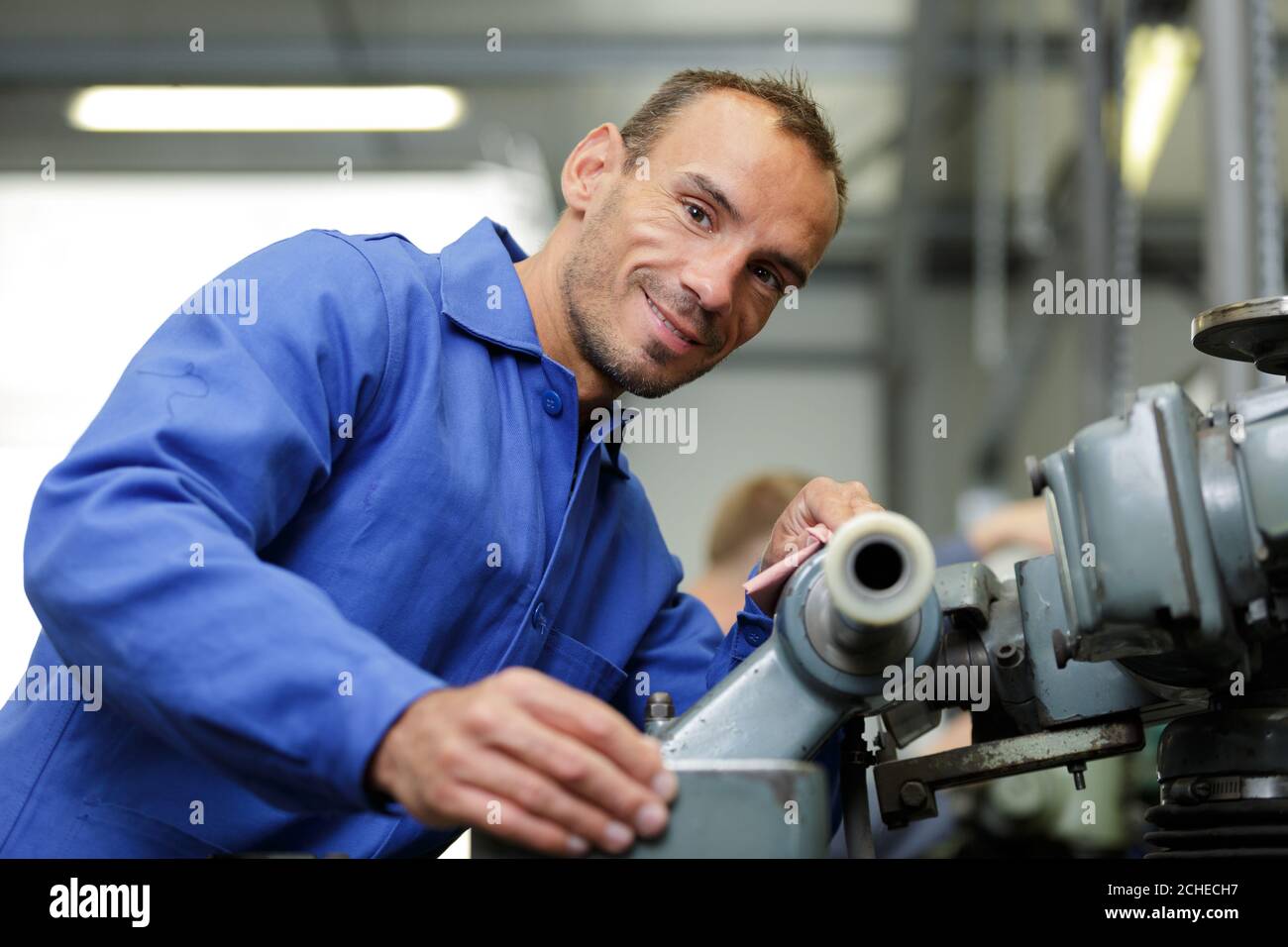 mechanic man working with a pipe Stock Photo - Alamy