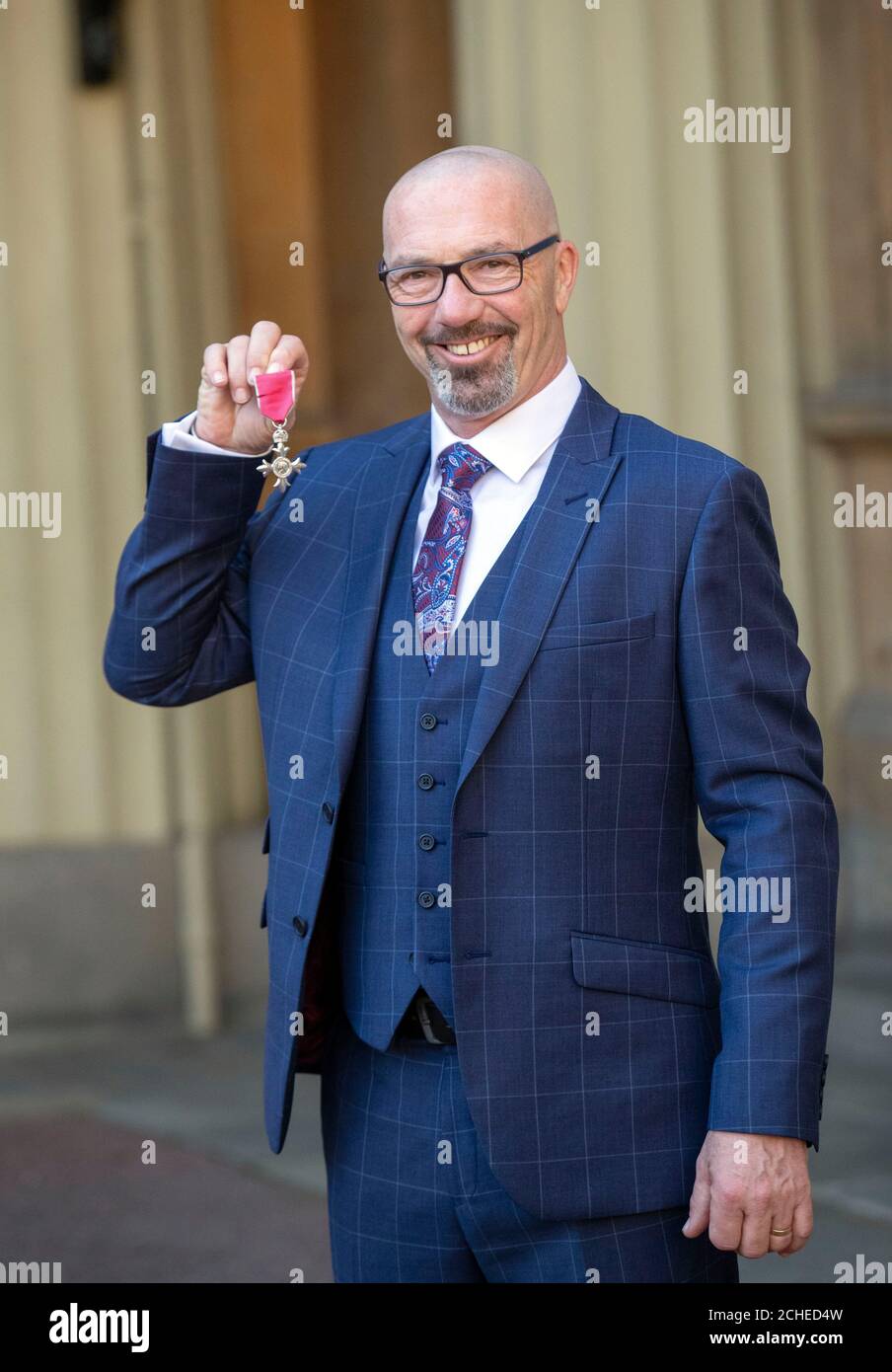 Former England cricketer Matthew Maynard with his MBE, awarded for ...