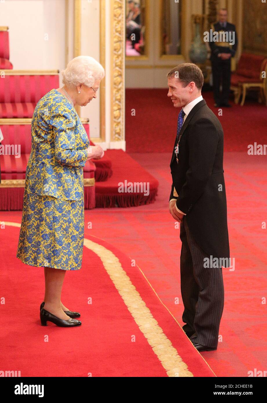 Receives An Obe From The Queen At Buckingham Palace High Resolution ...