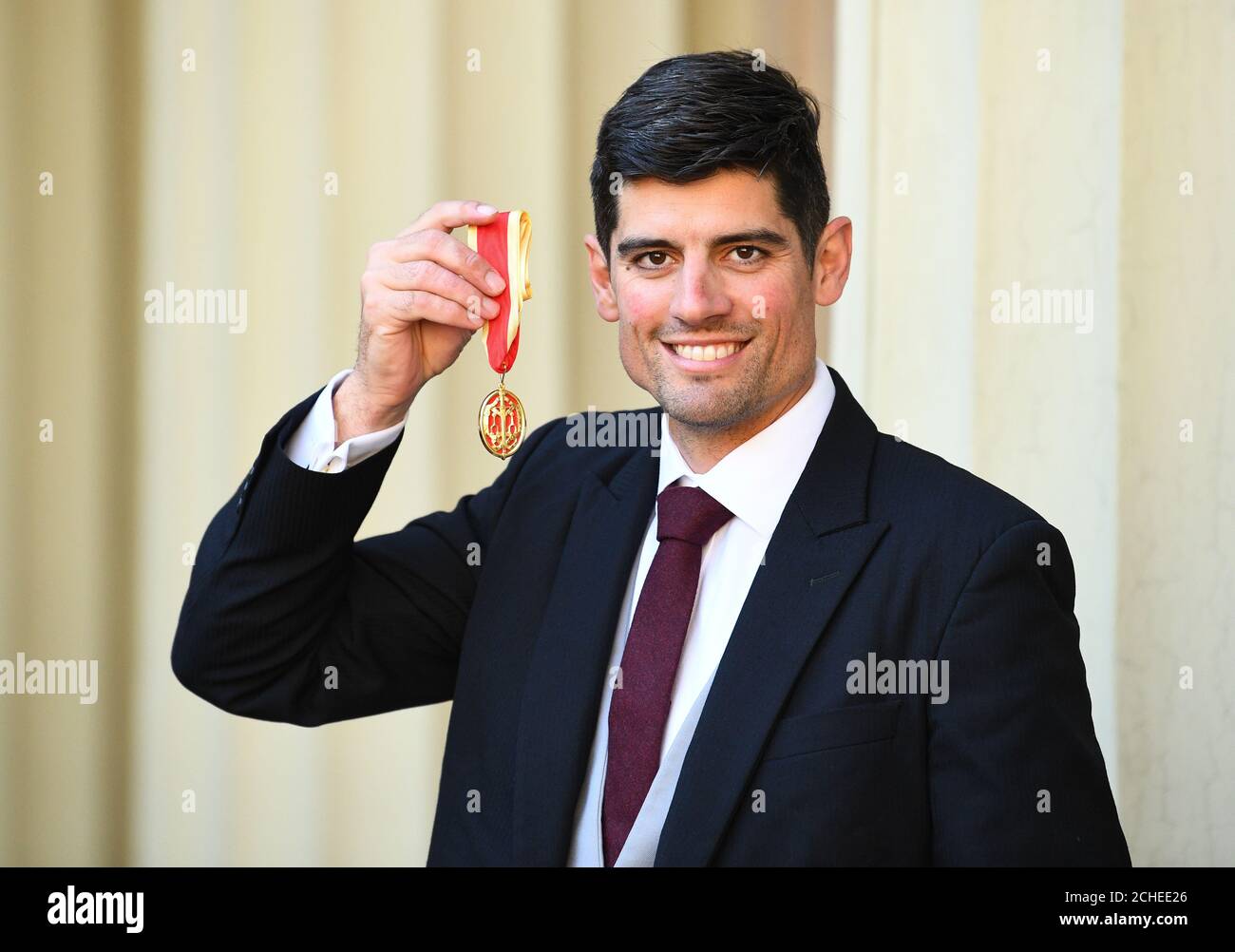 Alastair Cook with his knighthood following an investiture ceremony at ...
