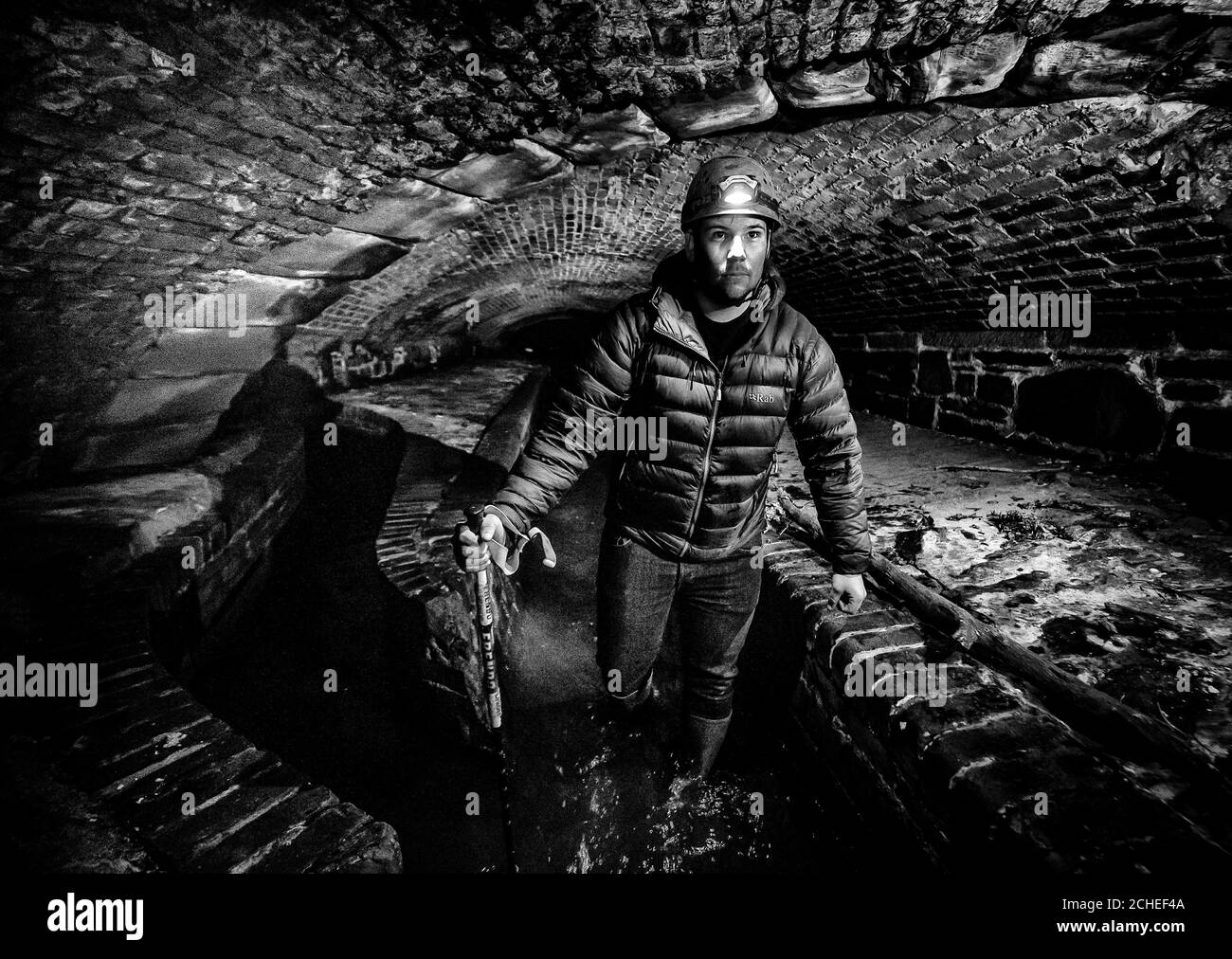 A man urban caving as an underground network of rivers are opened up to ...