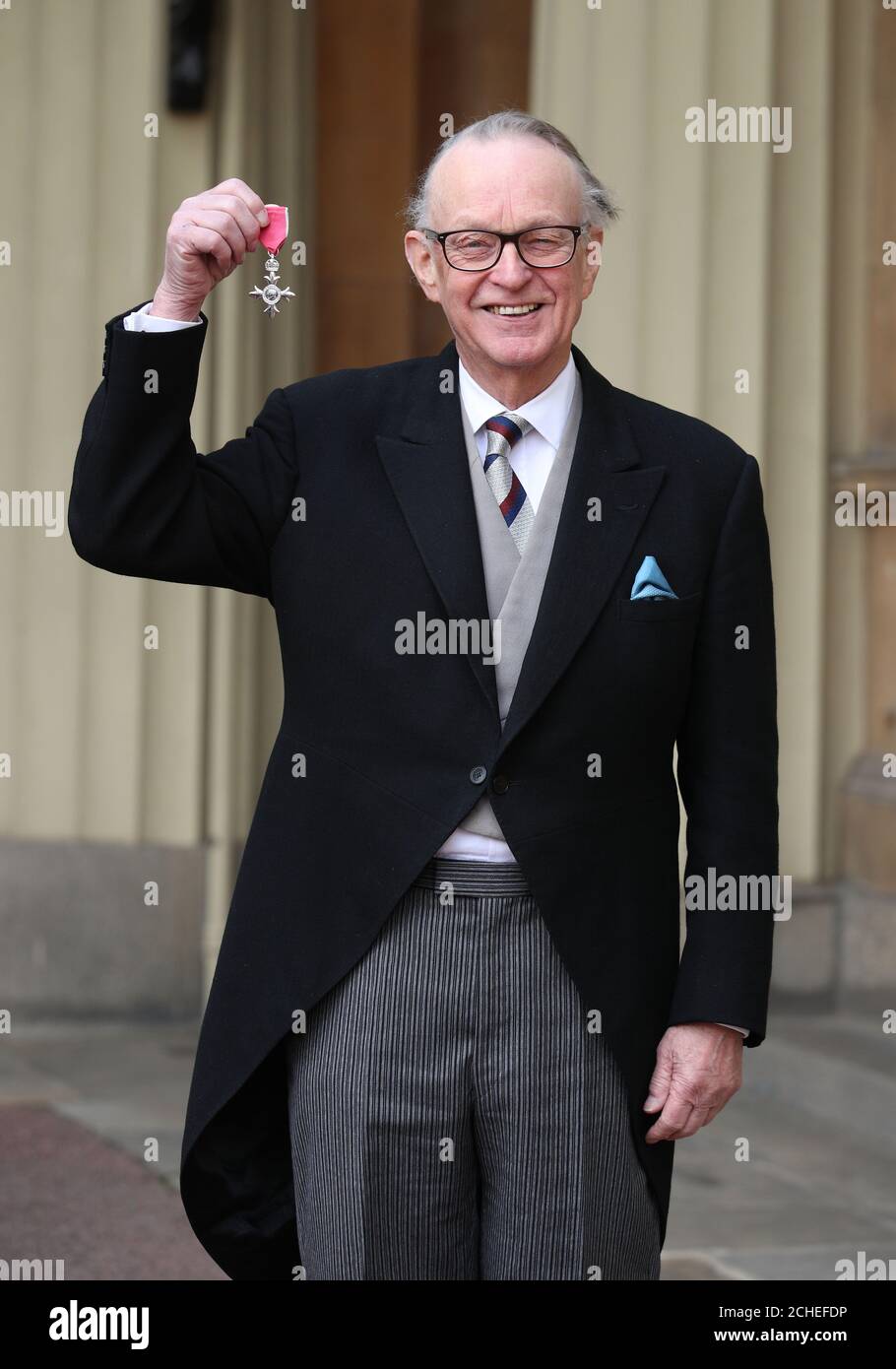 Robert Andrews with his MBE following an investiture ceremony at ...