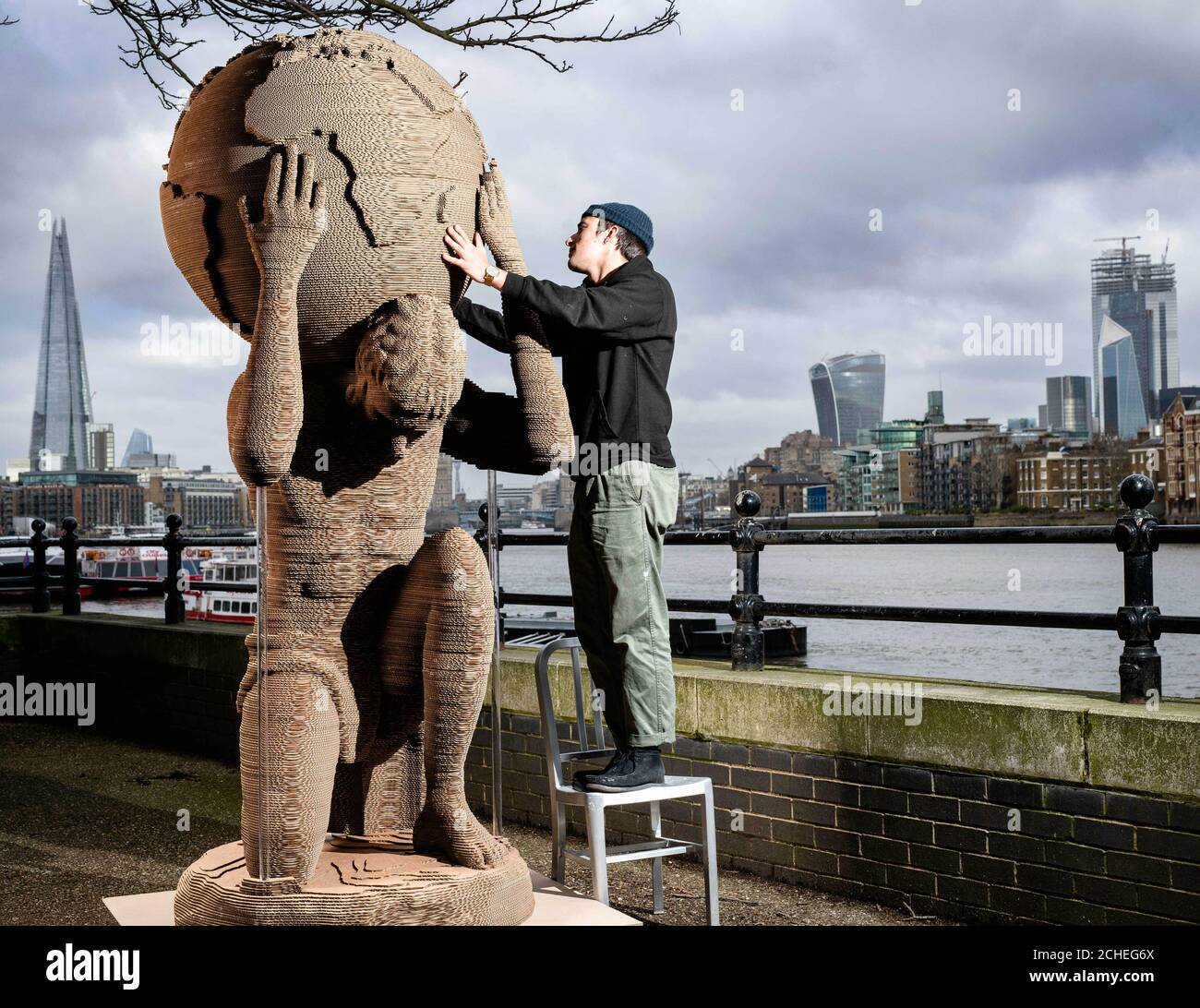 EDITORIAL USE ONLY Artist Patrick McCrossen puts the finishing touches ...