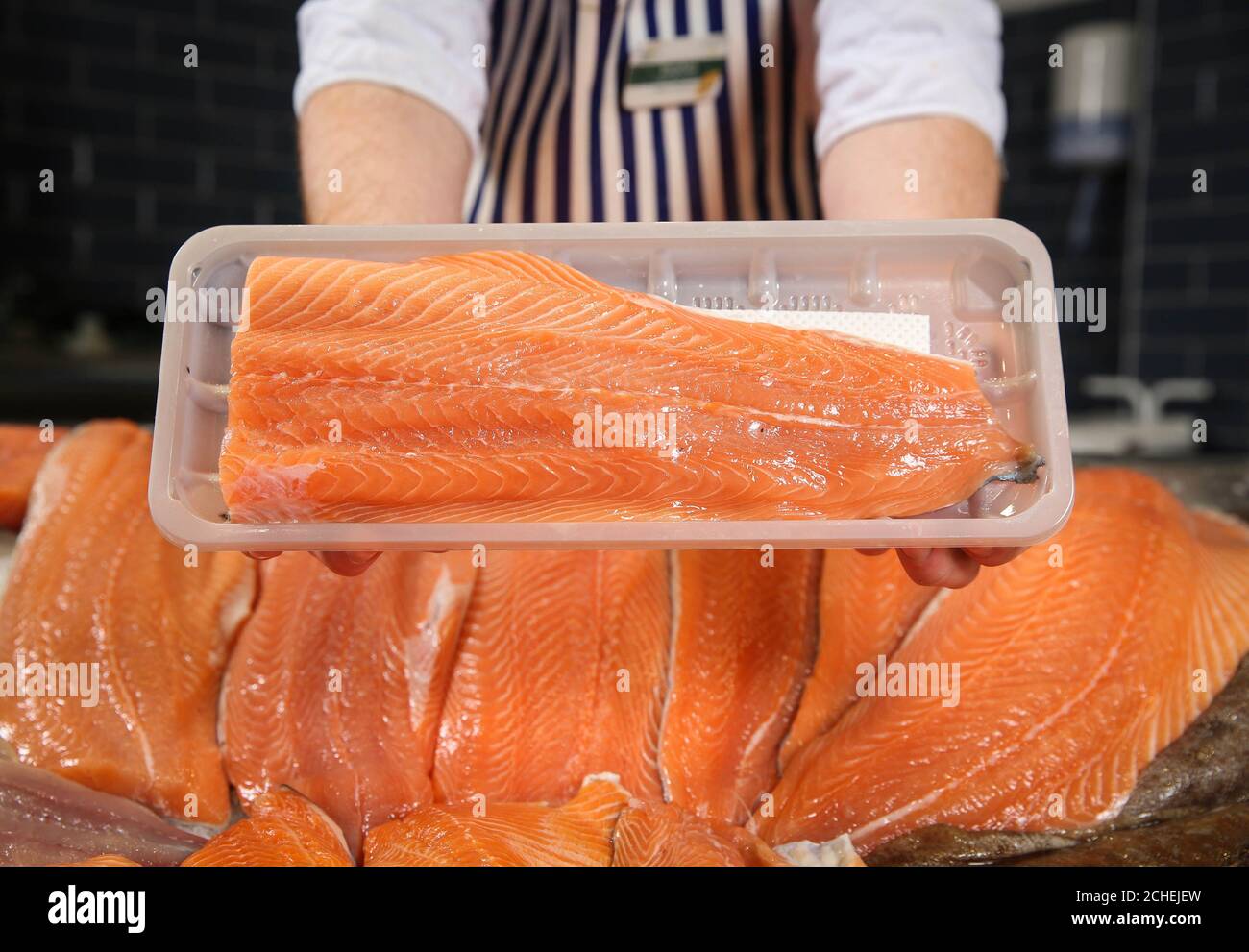 EDITORIAL USE ONLY Fishmonger Stephen Mervyn displays the new clear ...