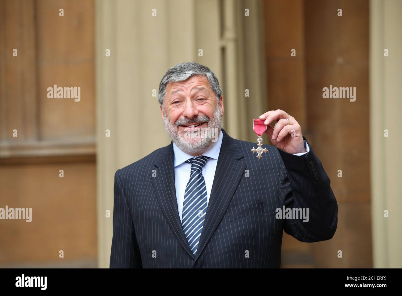 Rabbi Warren Elf holds his MBE for services to to the community in ...