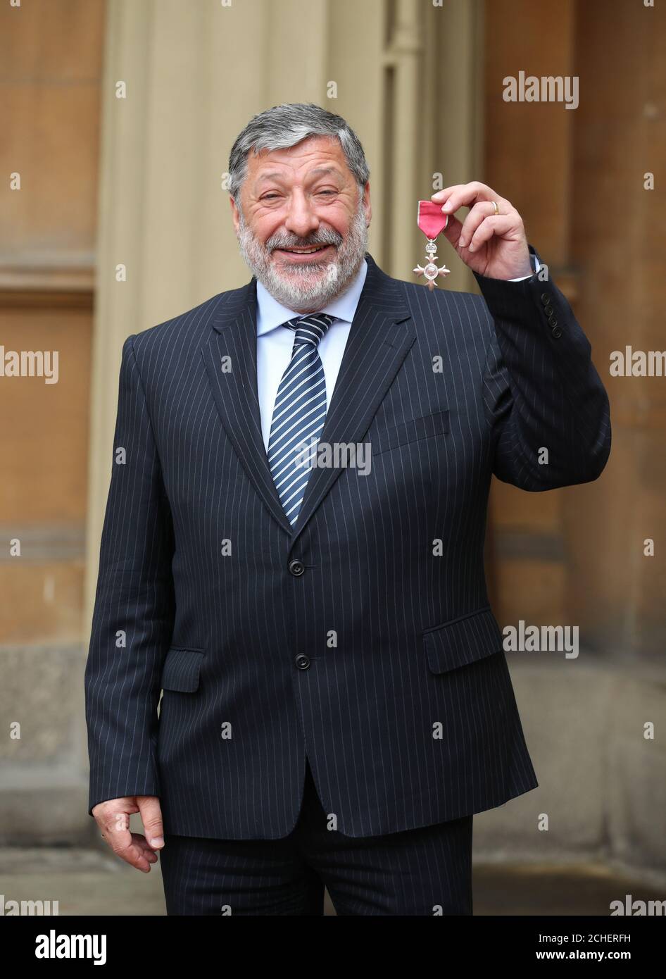 Rabbi Warren Elf holds his MBE for services to to the community in ...