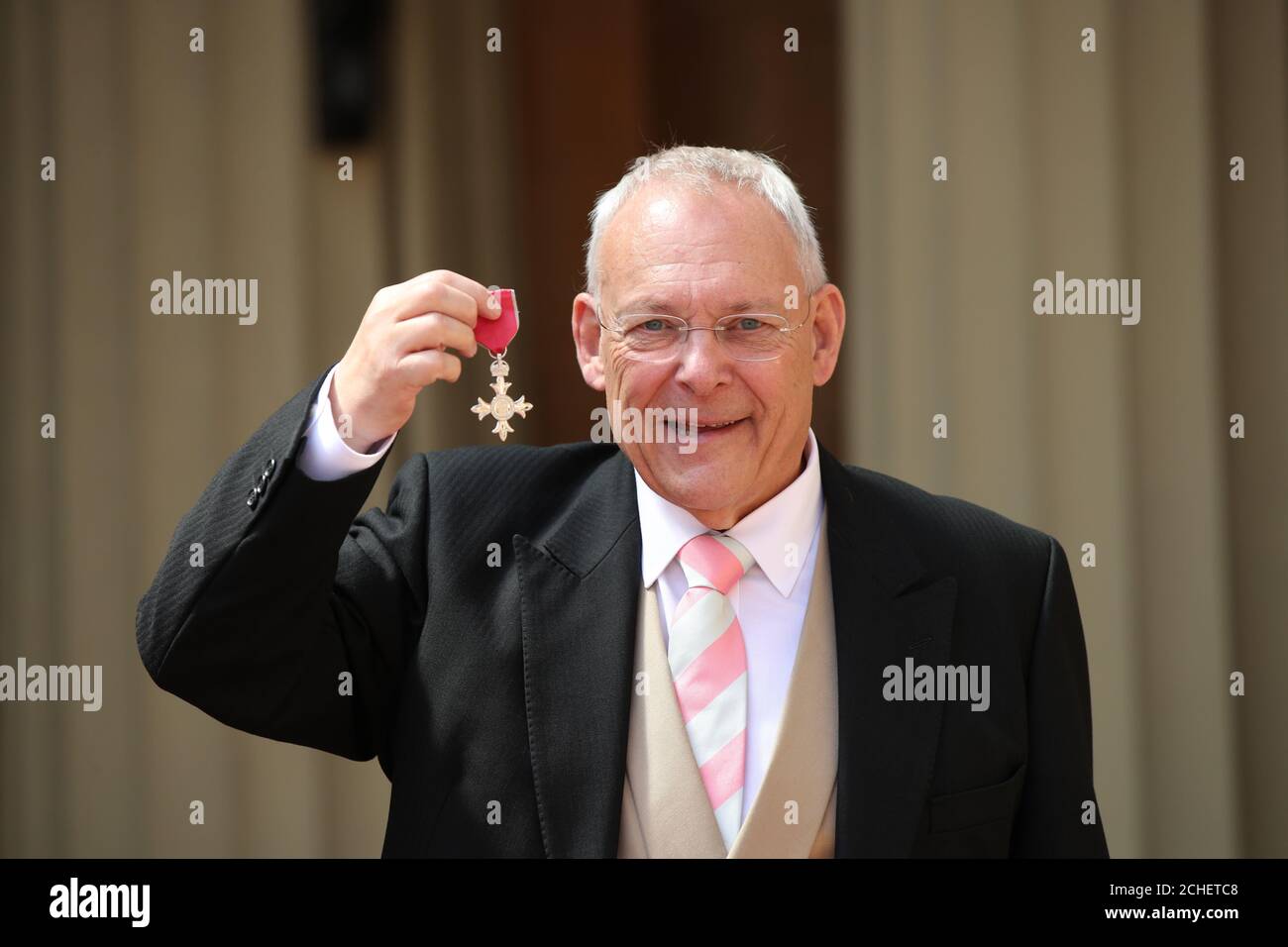 Gary Newbon with his MBE following an investiture ceremony at ...