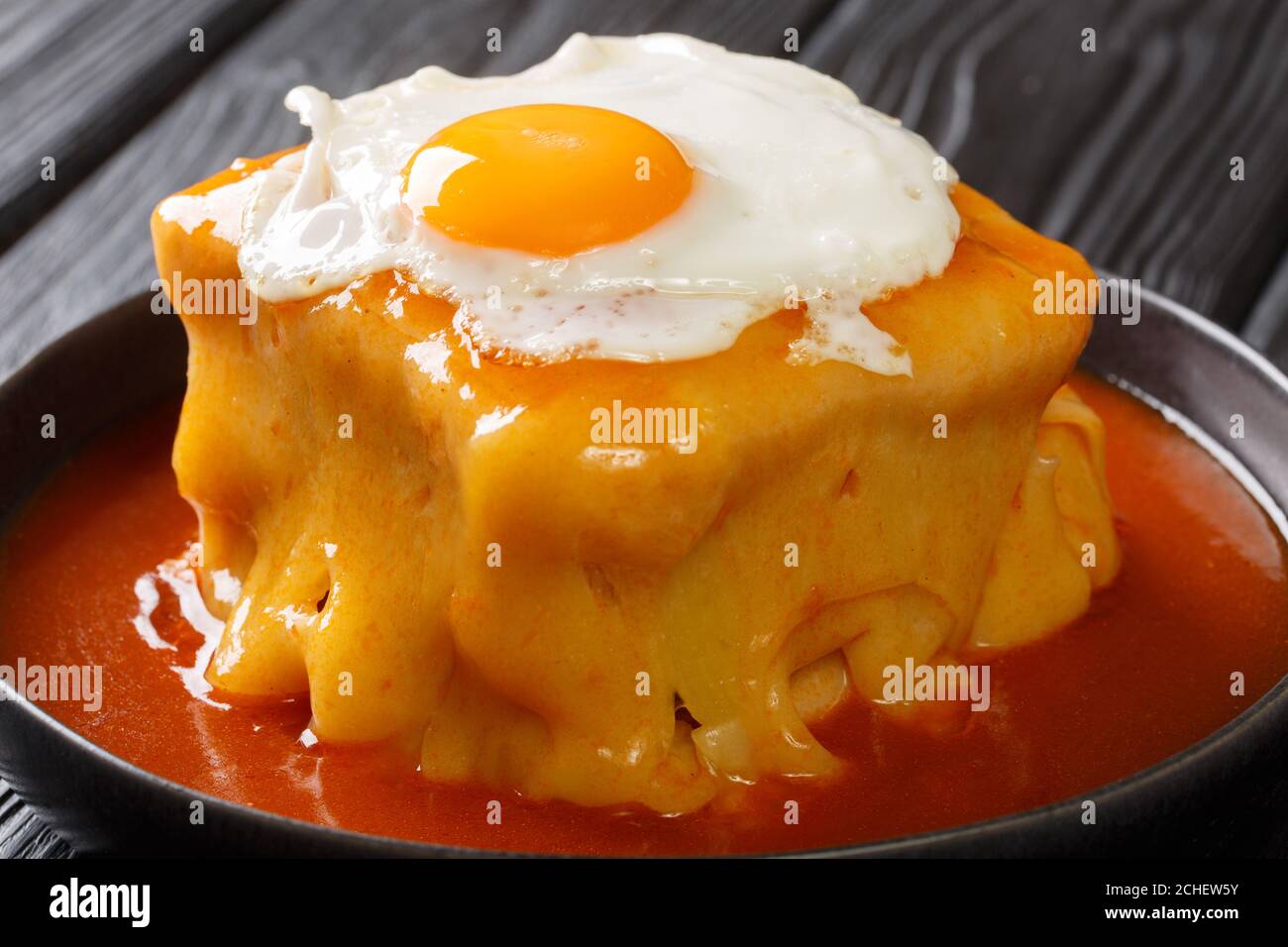 Francesinha is a Portuguese sandwich originally from Porto, made with ...