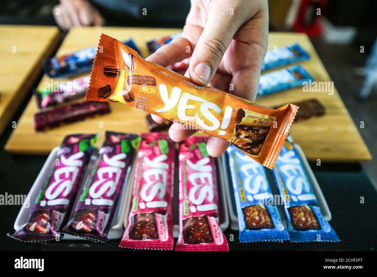 A selection of Nestle YES! snack bars wrapped in recyclable paper is ...