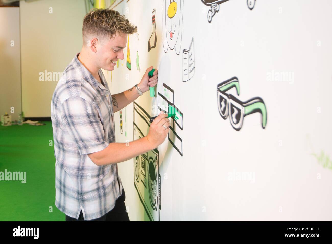 EDITORIAL USE ONLY Jack Maynard doodles at the 7UP Free Fido Dido House ...