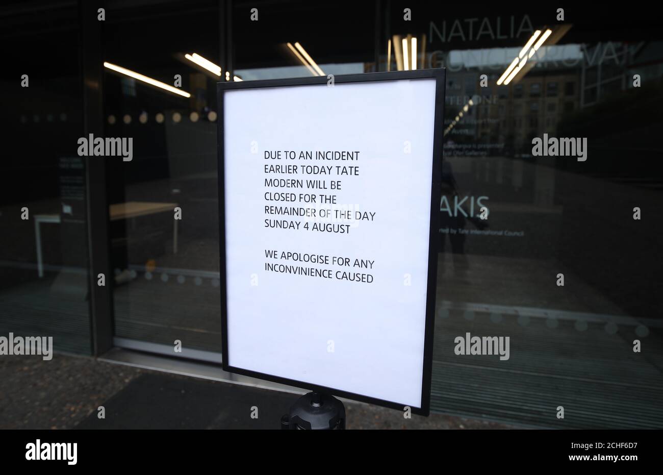 A sign posted outside of the Tate Modern reminds visitors the gallery ...