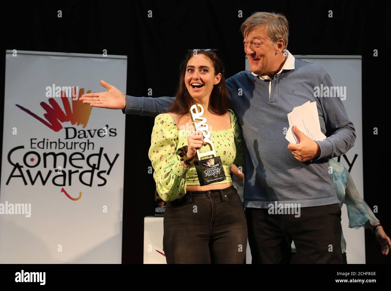 EDITORIAL USE ONLY Stephen Fry presents Catherine Cohen with her award ...