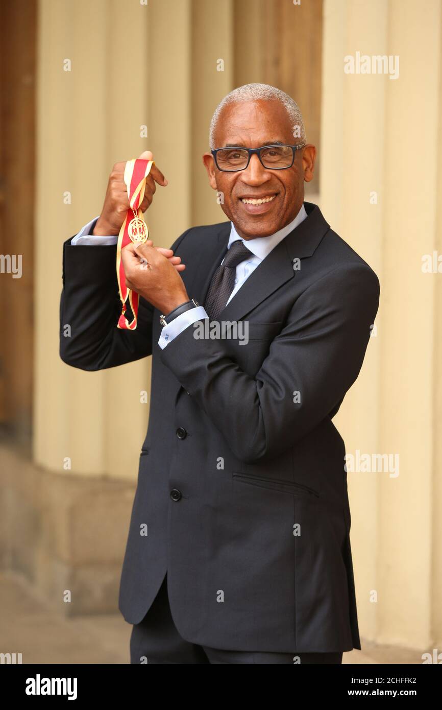 Who received knighthood during an investiture ceremony at buckingham ...