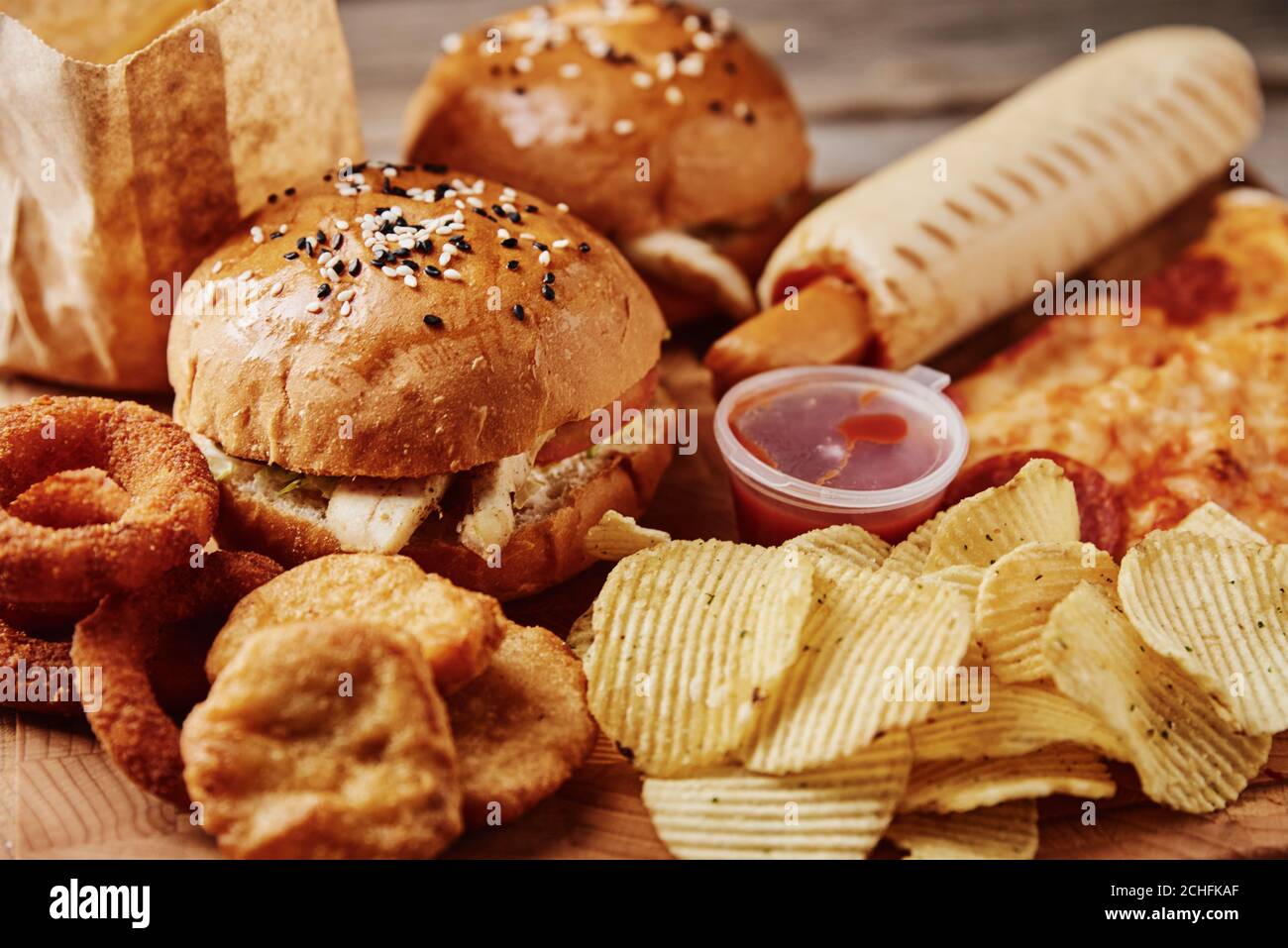 Unhealthy and junk food. Different types of fastfood and snacks on the ...