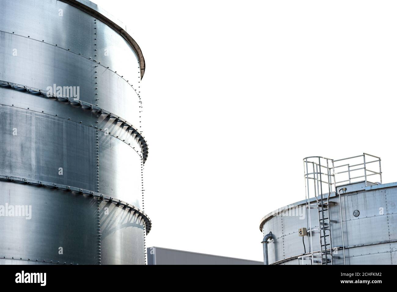 Steel industrial silos for liquids and solids standing in a factory ...