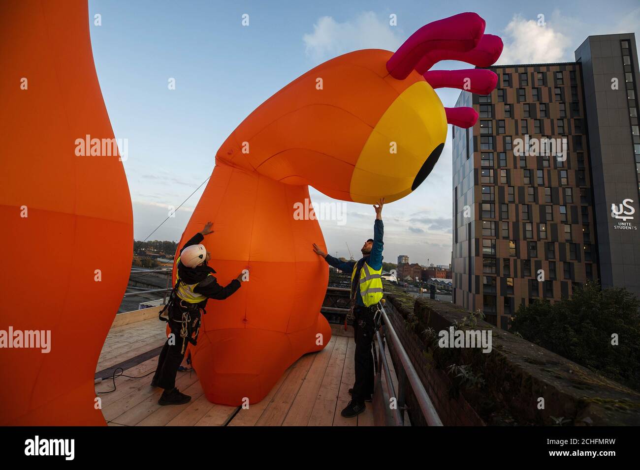 Riggers complete final checks on a giant monster inflatable, created by ...