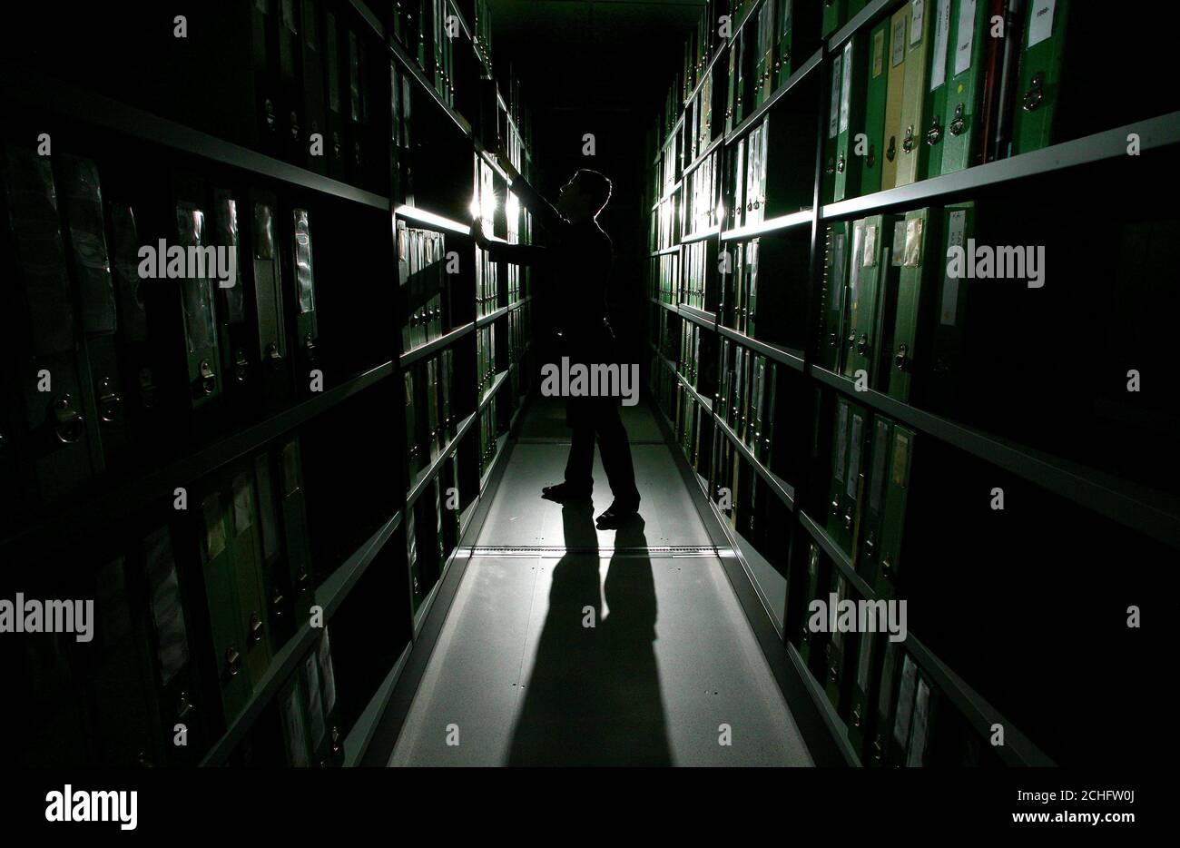 A man works in the archives beneath the Tate Britain in central London ...