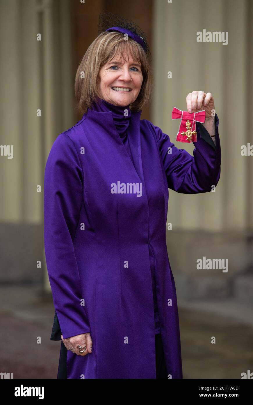 Author Theresa Breslin with her OBE medal, following an investiture ...