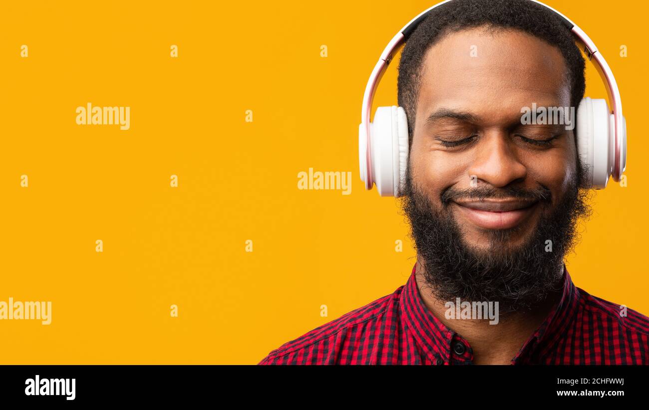 African man listening music using hi-res stock photography and images - Alamy