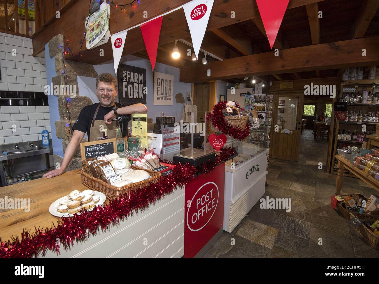 EDITORIAL USE ONLY Postmaster Chris Wildman at the newly opened Post ...