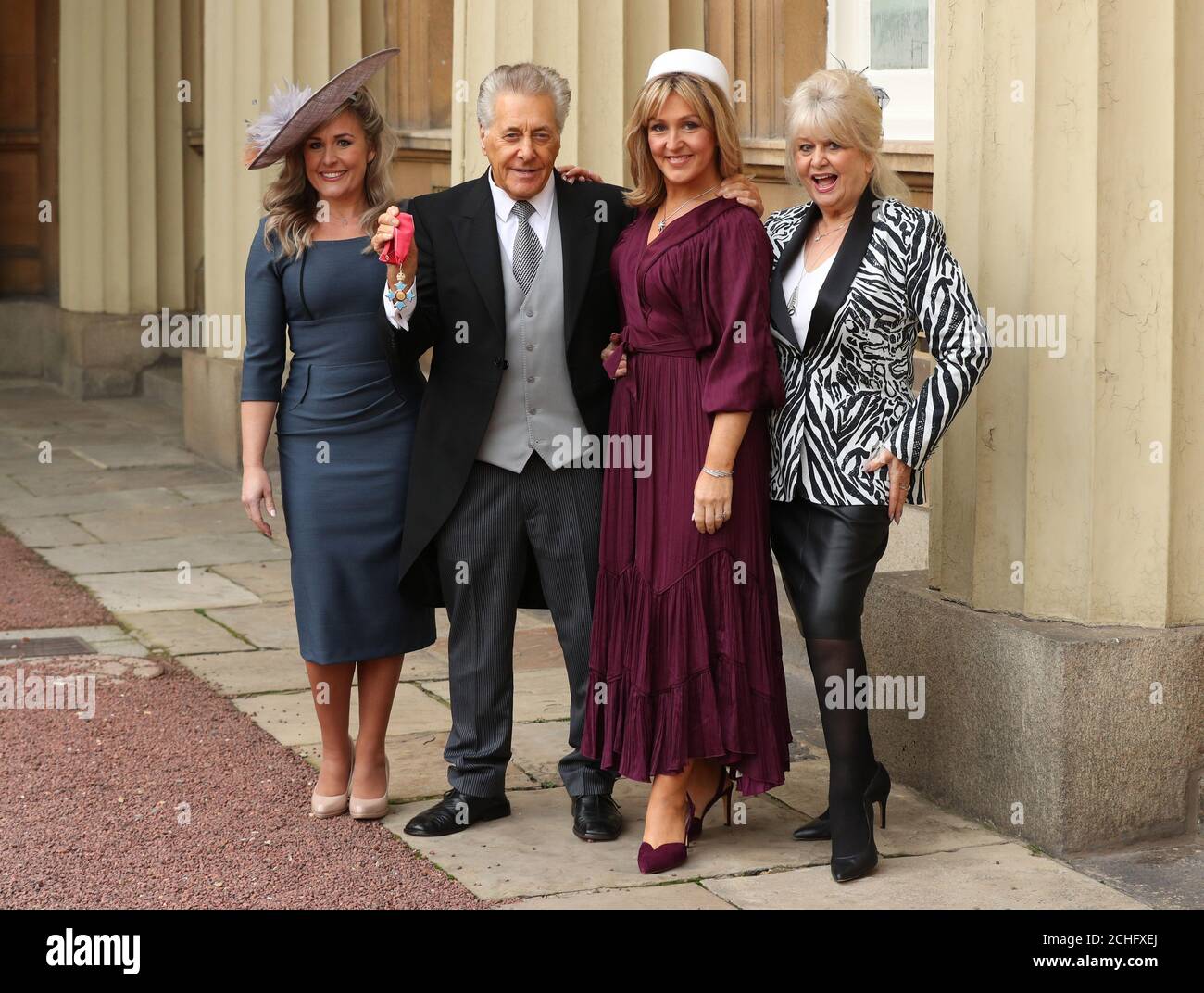 Mitch Murray (second left) is accompanied by daughters Mazz Murray ...