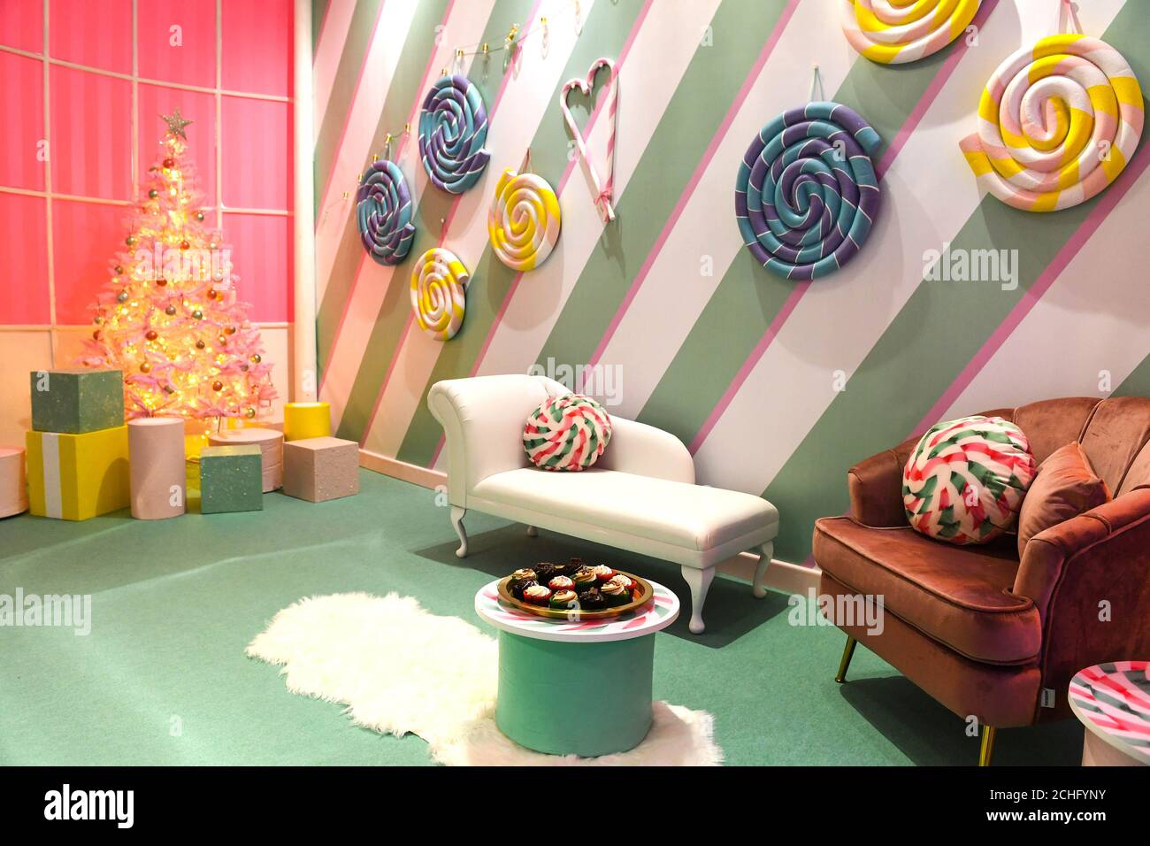 EDITORIAL USE ONLY A Candy Cane House is unveiled in Soho by Booking ...