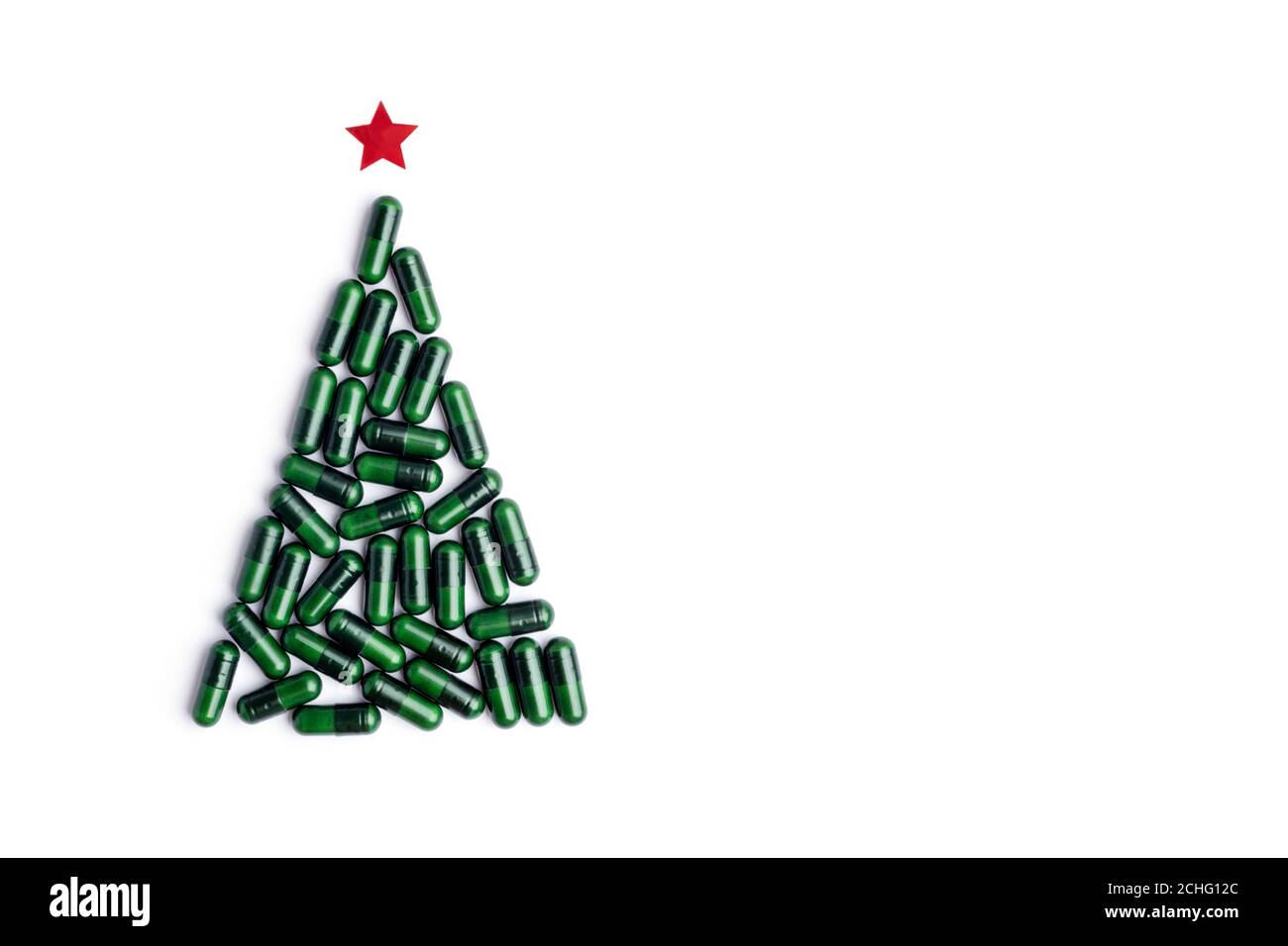 medicine pills shape of christmas tree on white background, Concept ...