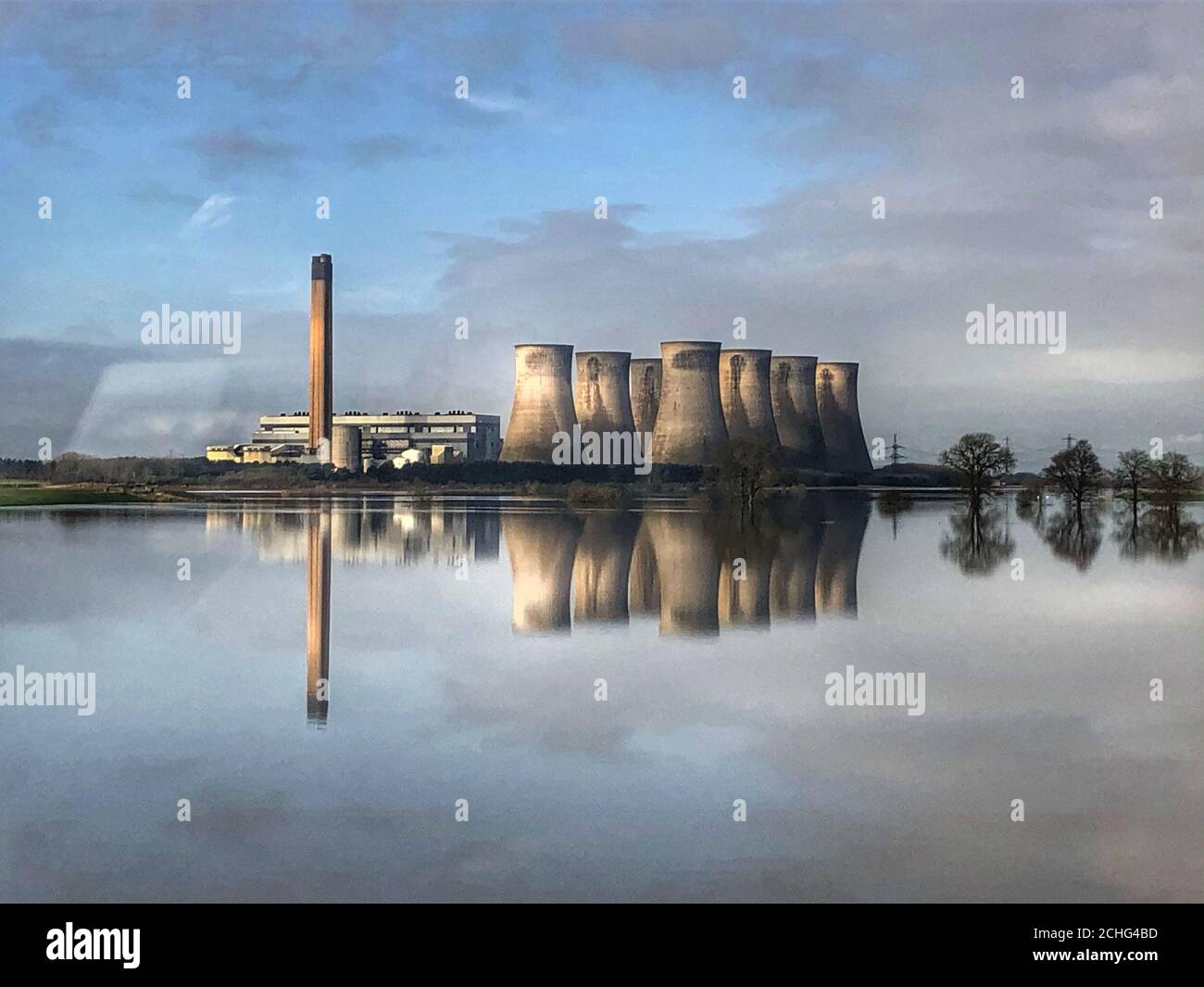Eggborough power station in North Yorkshire is reflected in floodwater ...