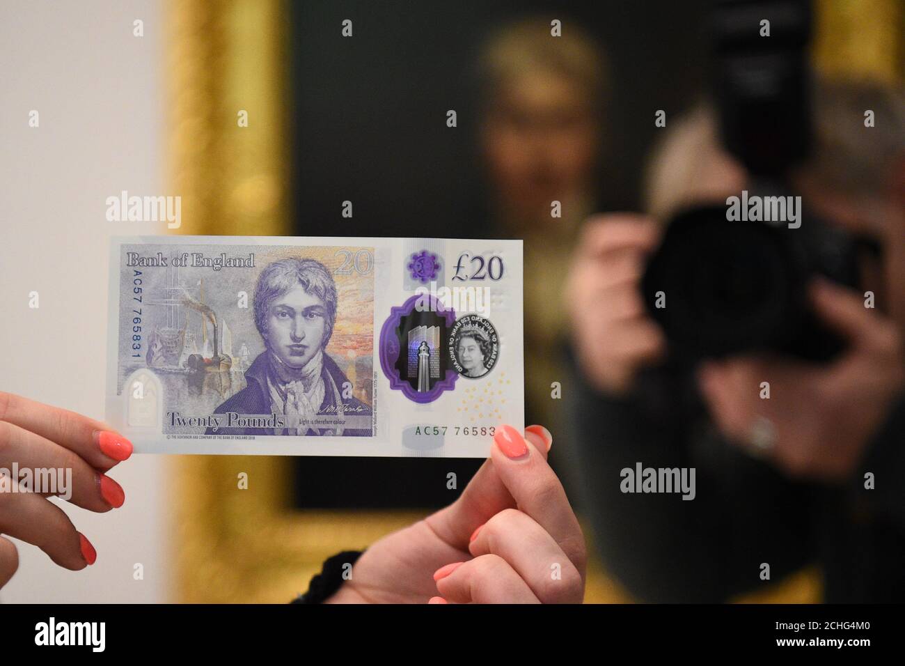 Photographers take pictures of the new £20 note which features artist ...