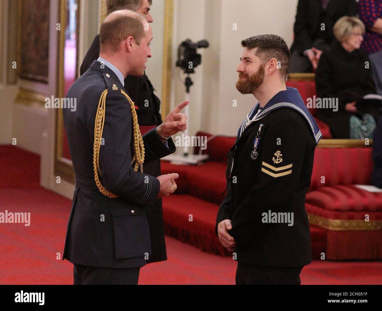 Leading Seaman David Groves, Royal Navy, is decorated with the Queen's ...