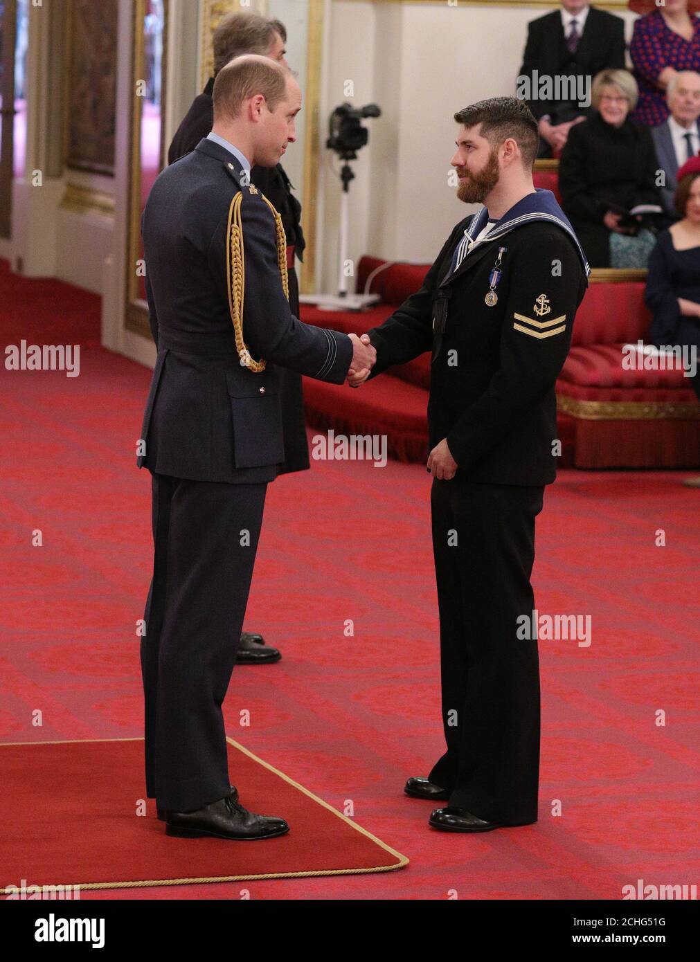 Leading Seaman David Groves, Royal Navy, is decorated with the Queen's ...
