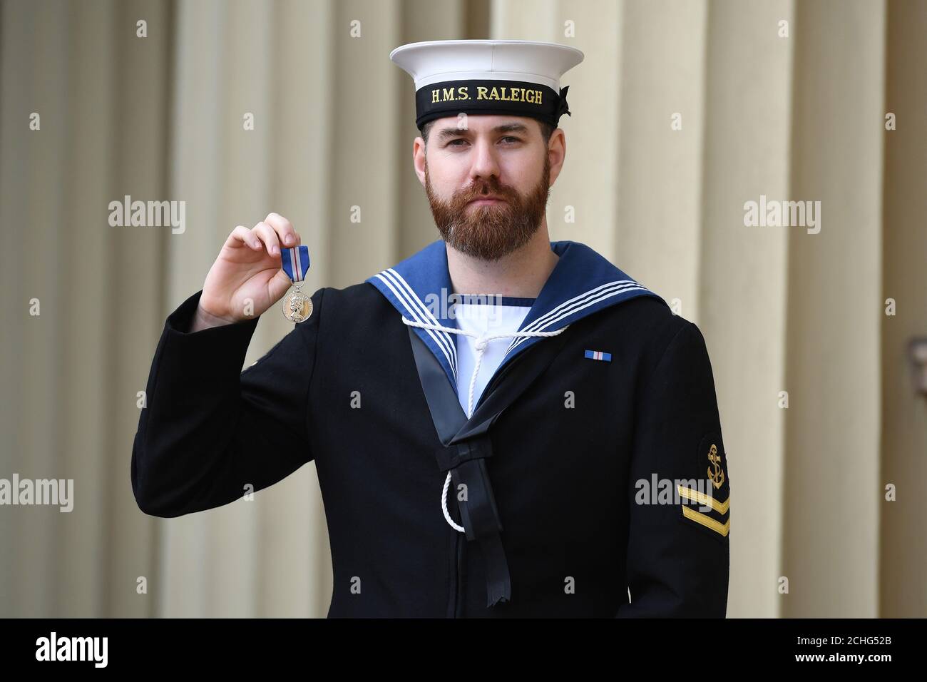 Leading Seaman David Groves with the Queen's Gallantry Medal, following ...