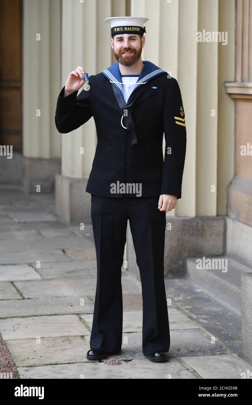 Leading Seaman David Groves with the Queen's Gallantry Medal, following ...