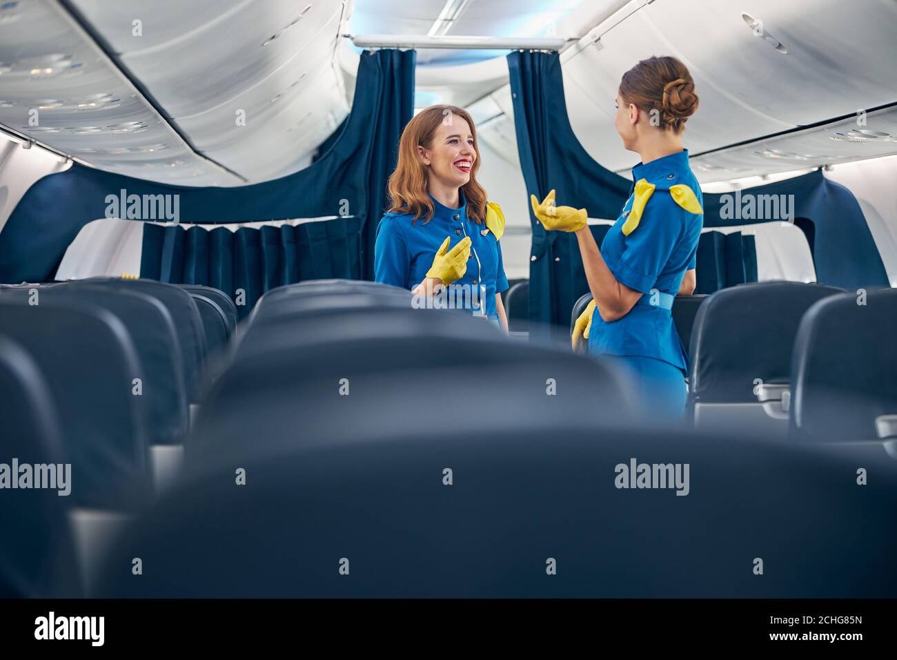 Woman economy class seat hi-res stock photography and images - Alamy