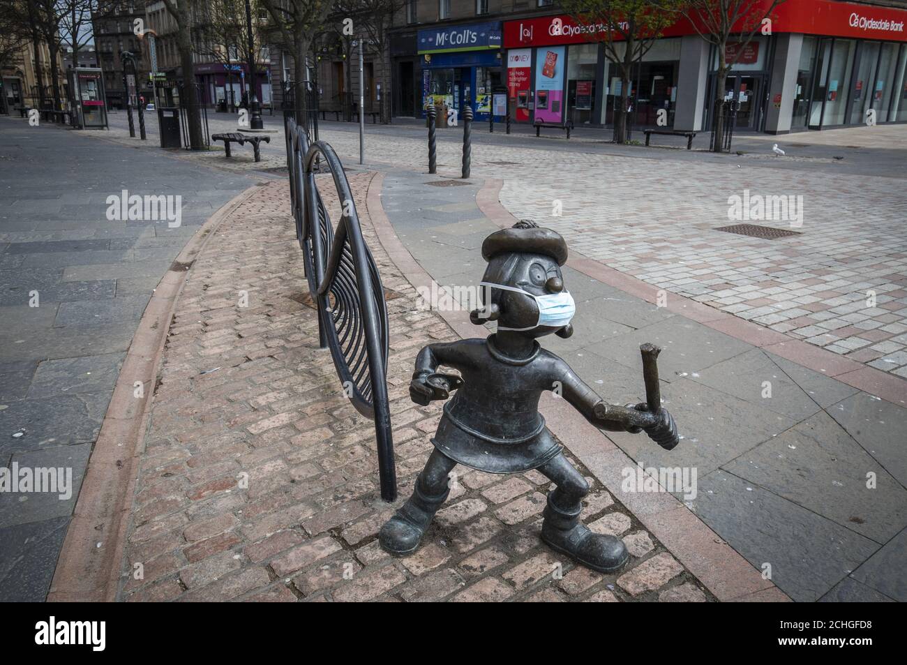 The statue of Beano character Minnie the Minx sports a protective face ...