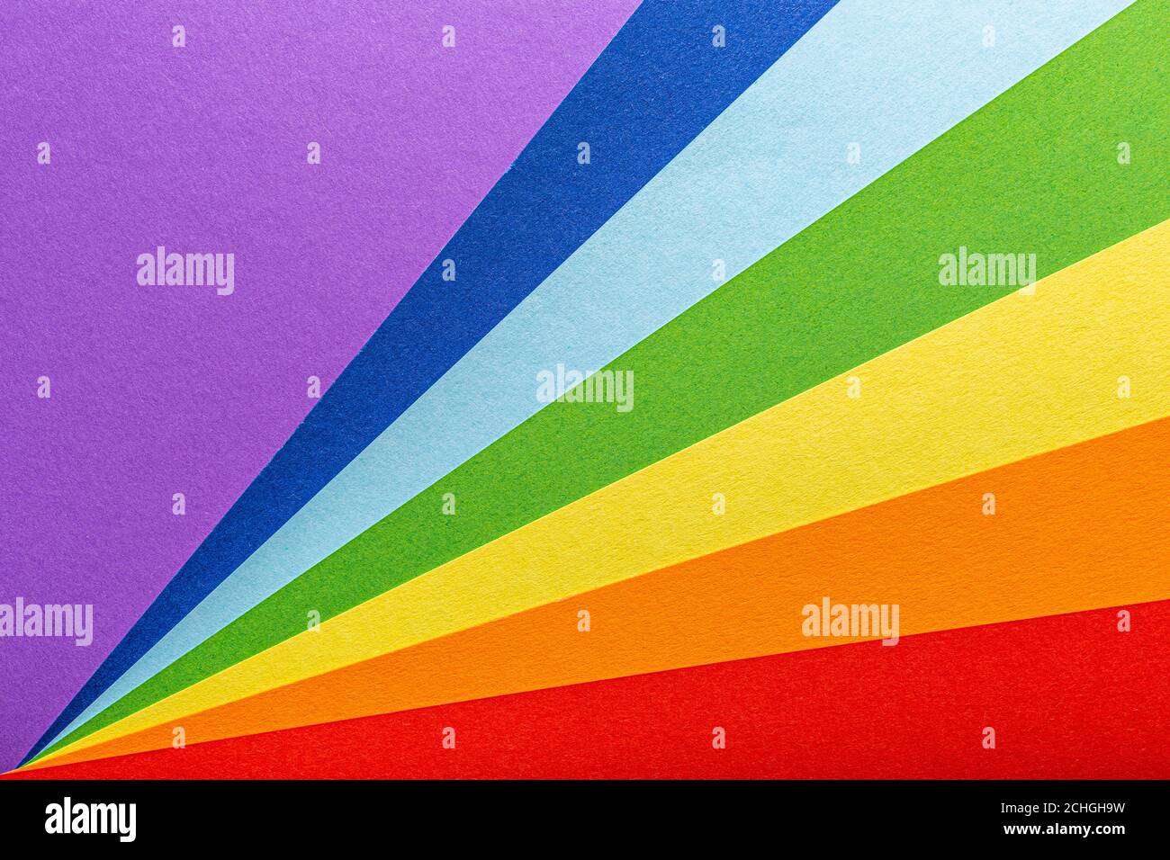 Paper rainbow colored rays stripes background Stock Photo - Alamy