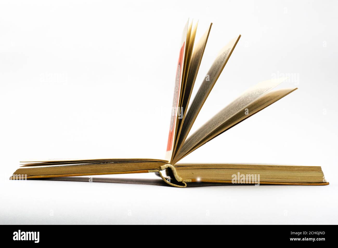 open book with yellowed sheets on a white background side view Stock ...