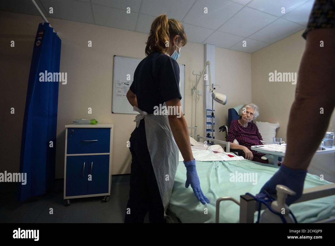 EMBARGOED TO 0001 FRIDAY MAY 29 Rehab Support workers talk with Morag ...