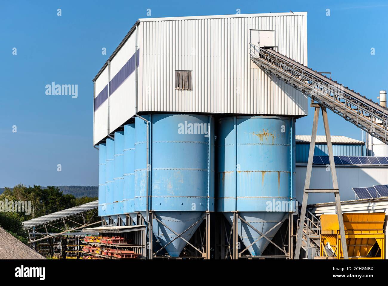 Big blue metallic Industrial silos for the production of cement at an ...