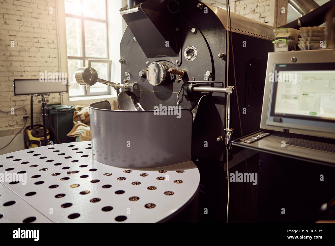 Coffee roasting machine with control panel and cooling bin Stock Photo ...