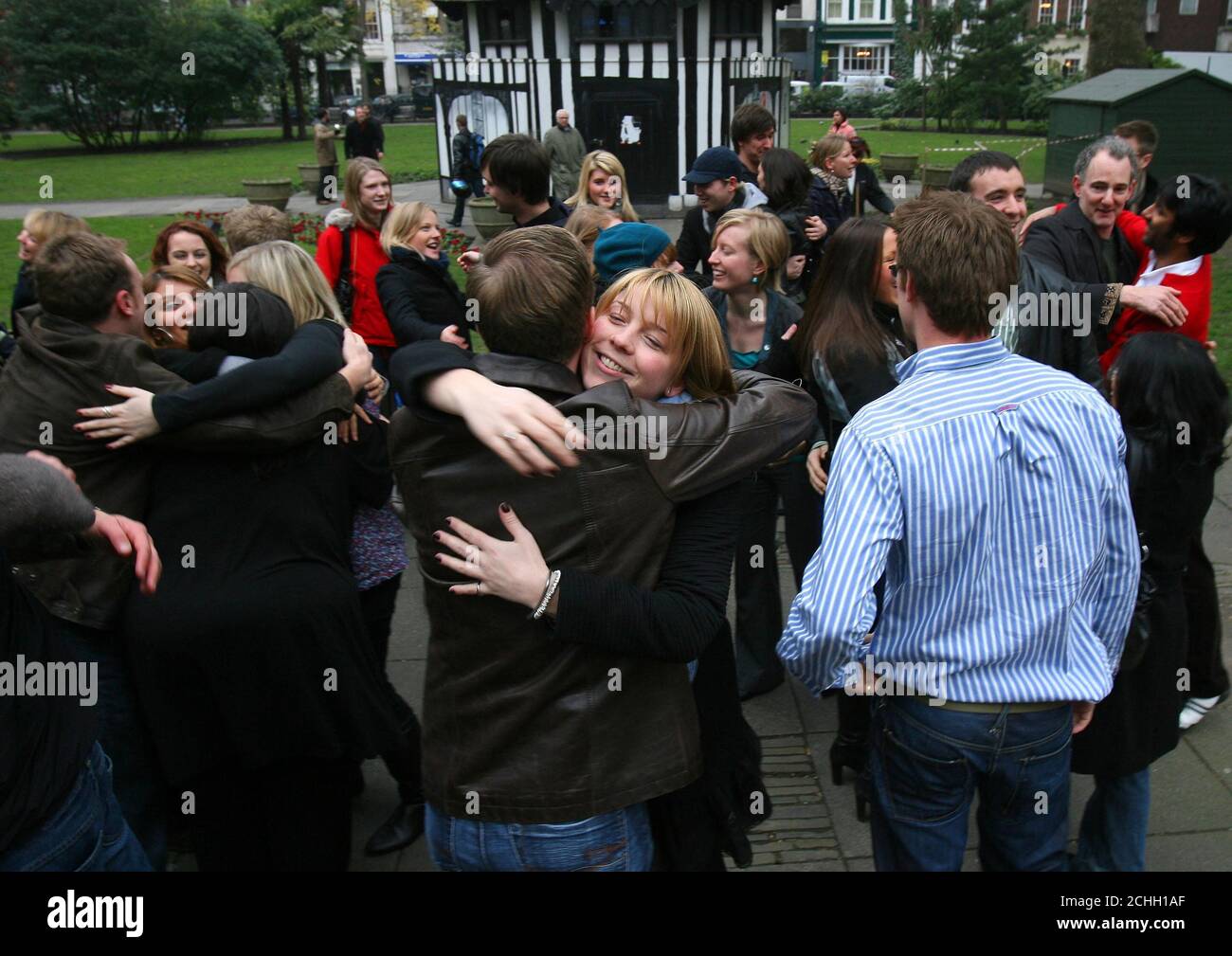 A crowd of strangers embrace in soho square hi-res stock photography ...