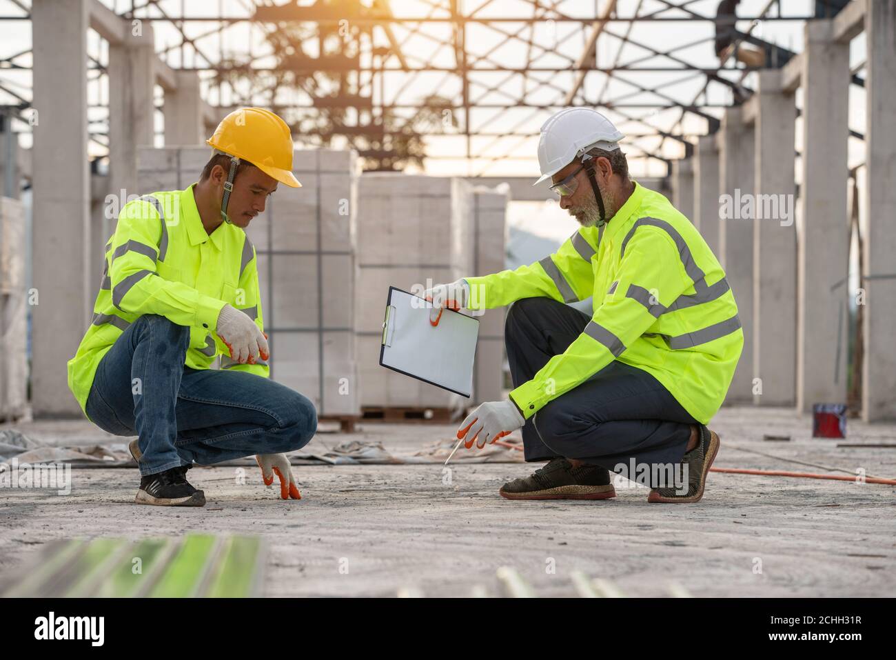 Quality inspection of cement floors by supervisor engineers and workers ...