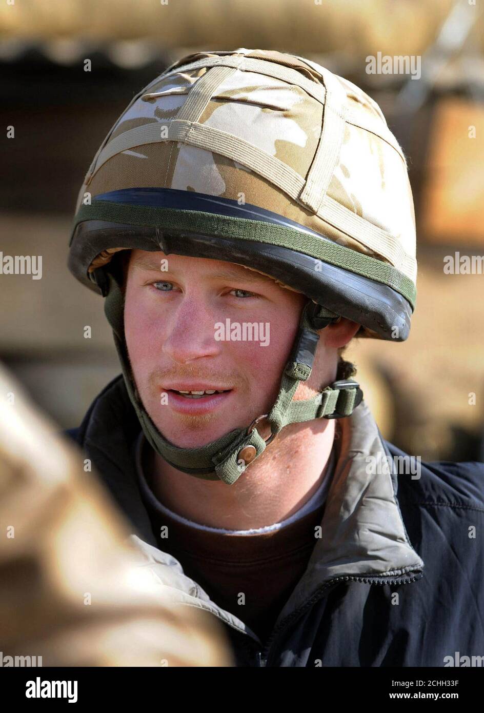 Prince Harry looks thoughtful as he sits at the observation post on ...