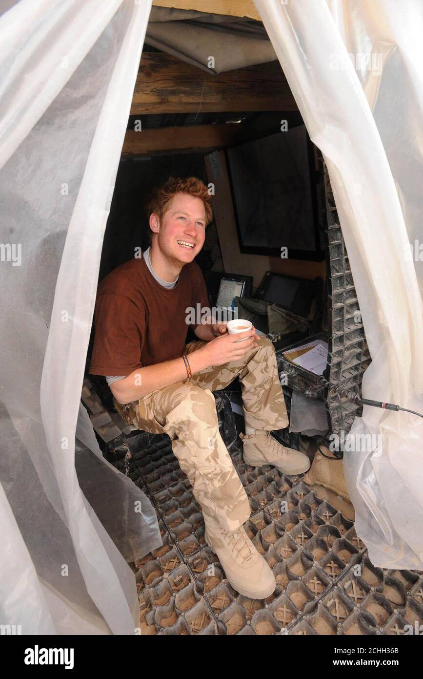 Prince Harry sits outside the Fire Planning Cell at JTAC Hill close to ...