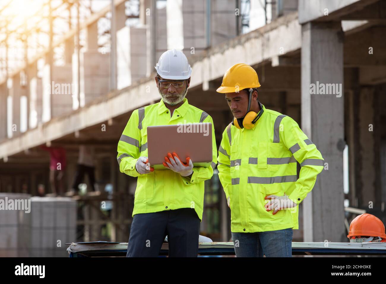 Supervisors and engineering use laptop at the construction site Stock ...