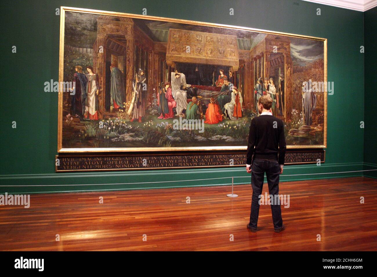 A man admires the last work by Edward Burne-Jones titled 'The Sleep of ...