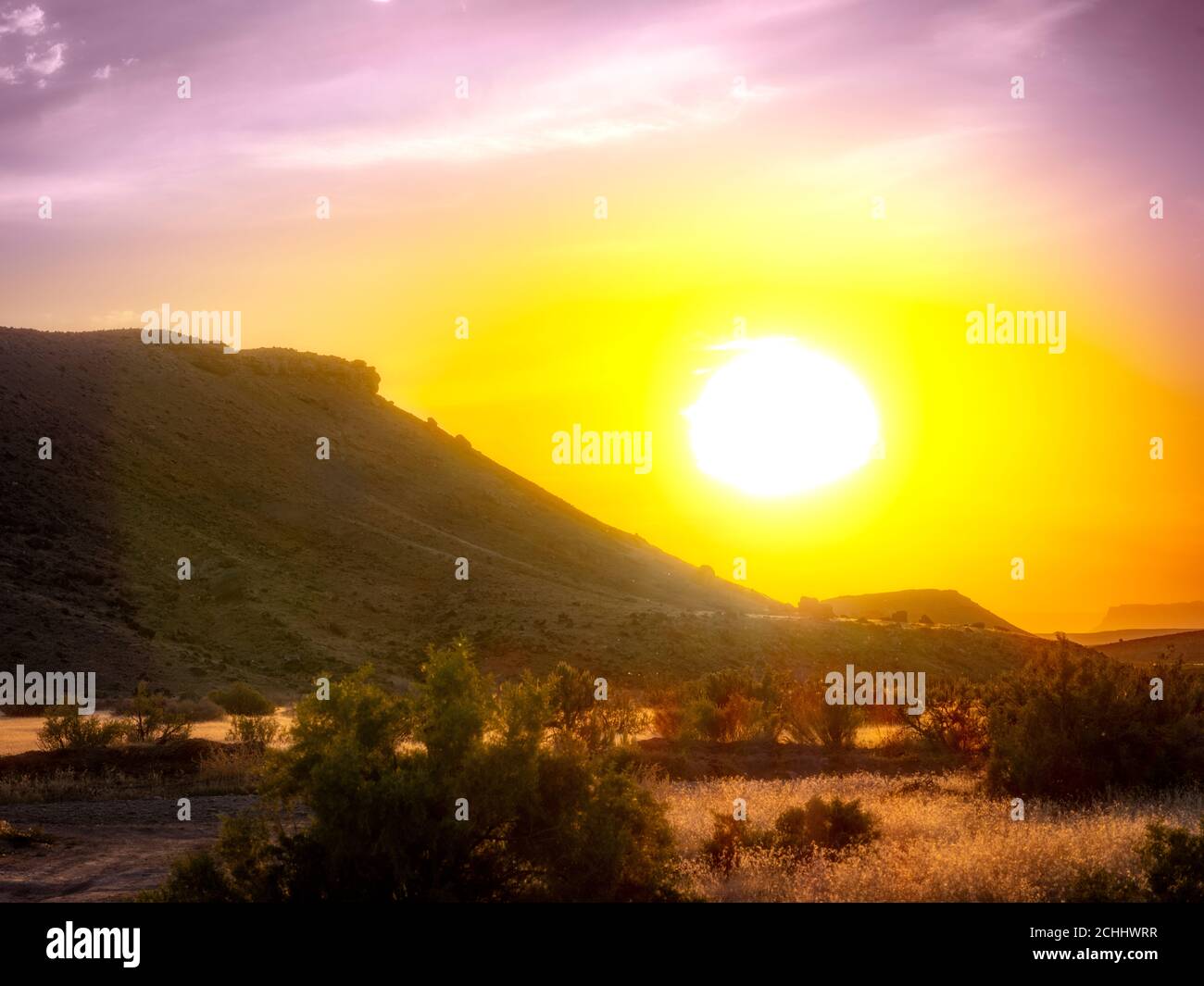 Sunset with flare, desert, near Moab Utah USA Stock Photo - Alamy