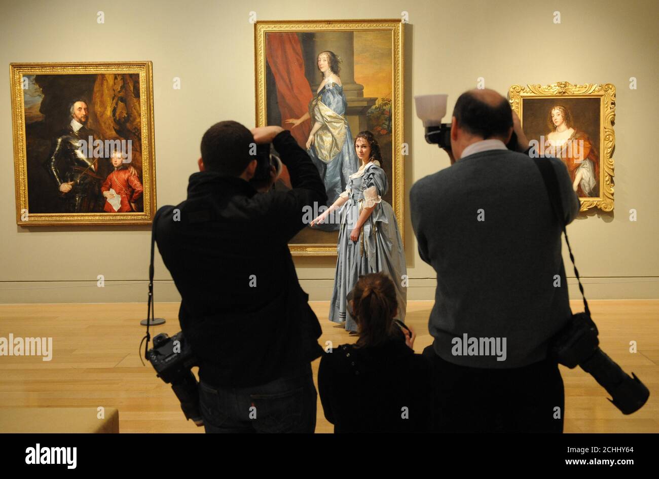 Emma Hall (dressed in period costume) poses in front of a painting by ...