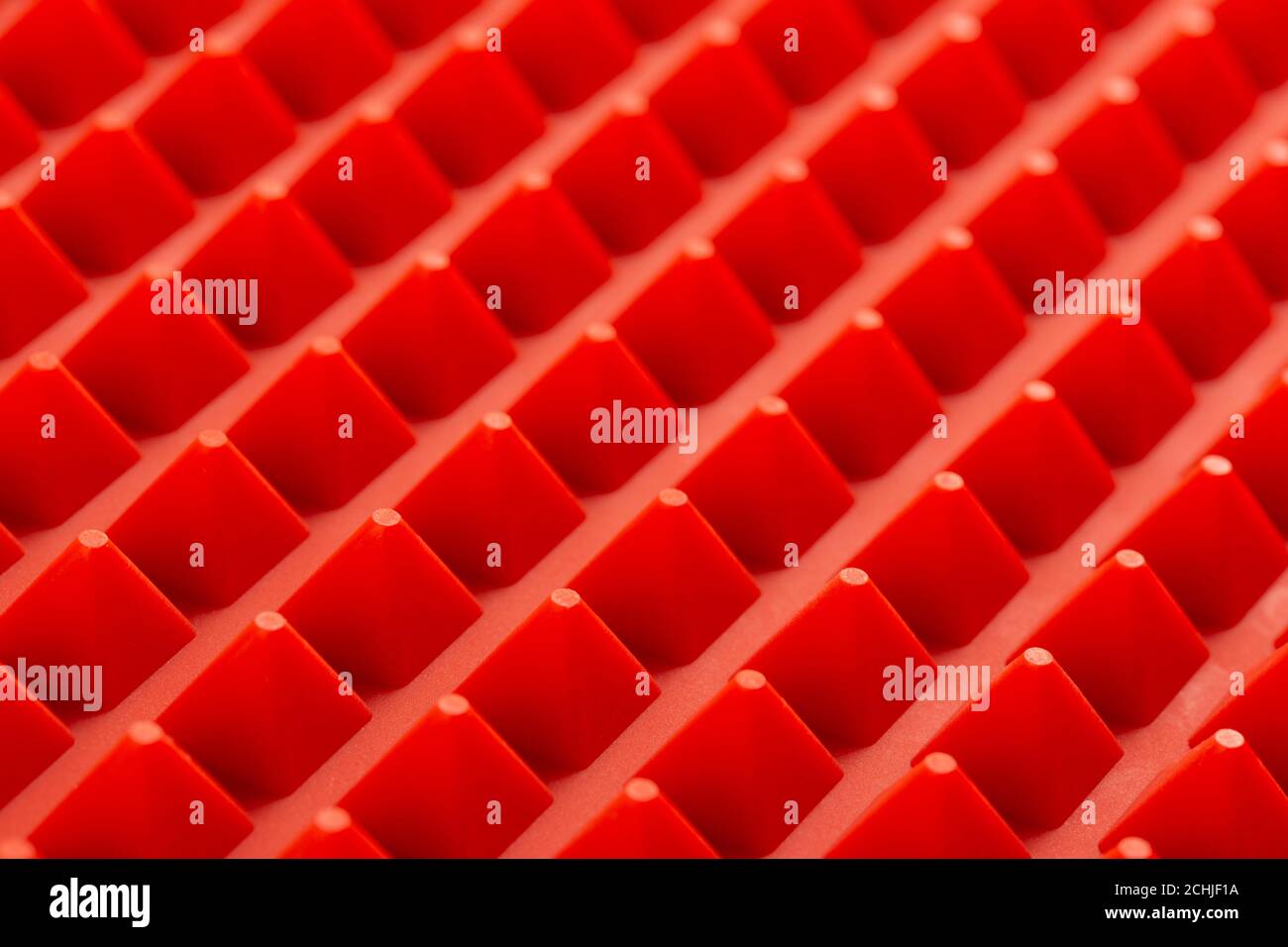 abstract red silicone pyramids array close-up background Stock Photo ...