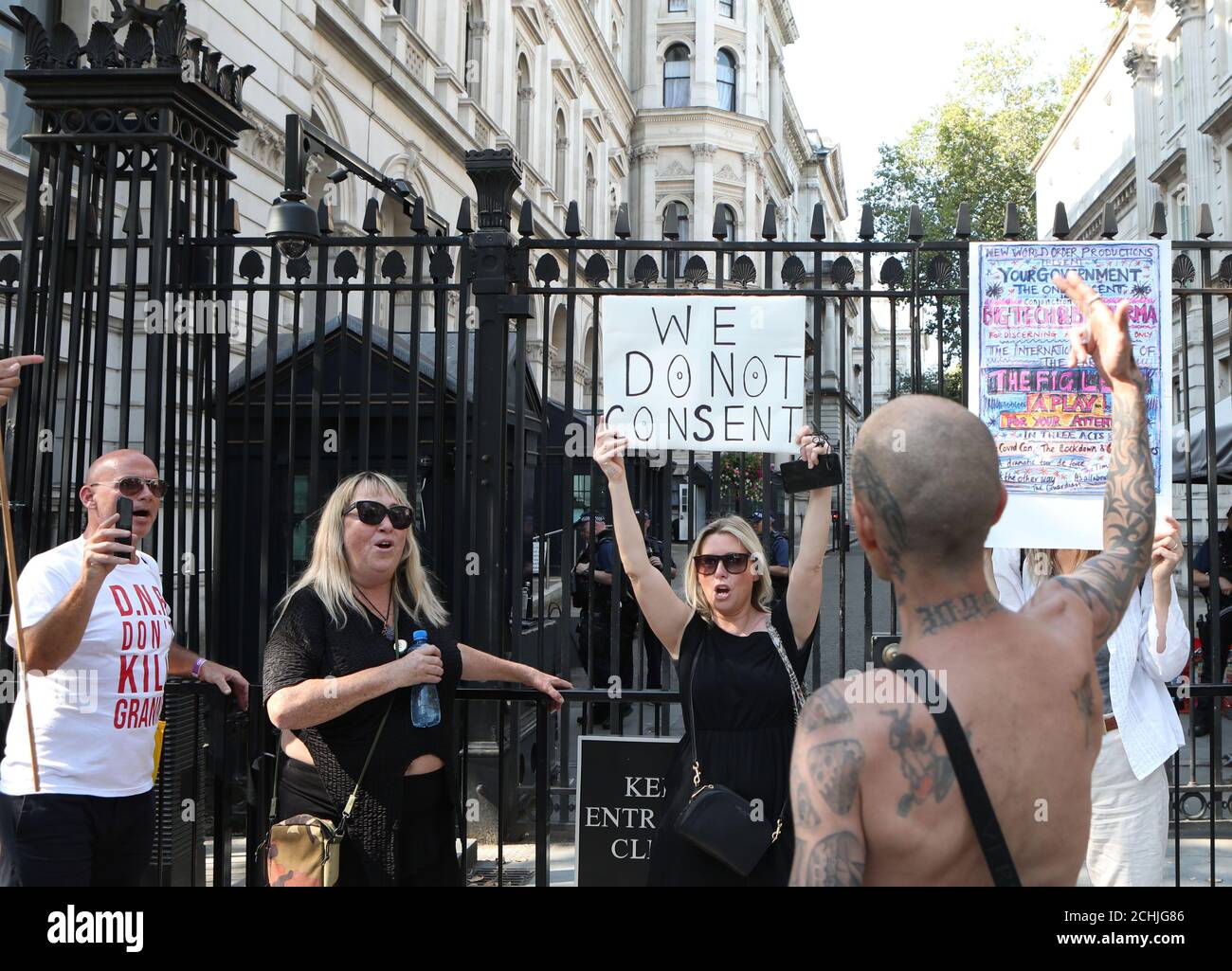 People mount a small protest outside Downing Street in London as the ...